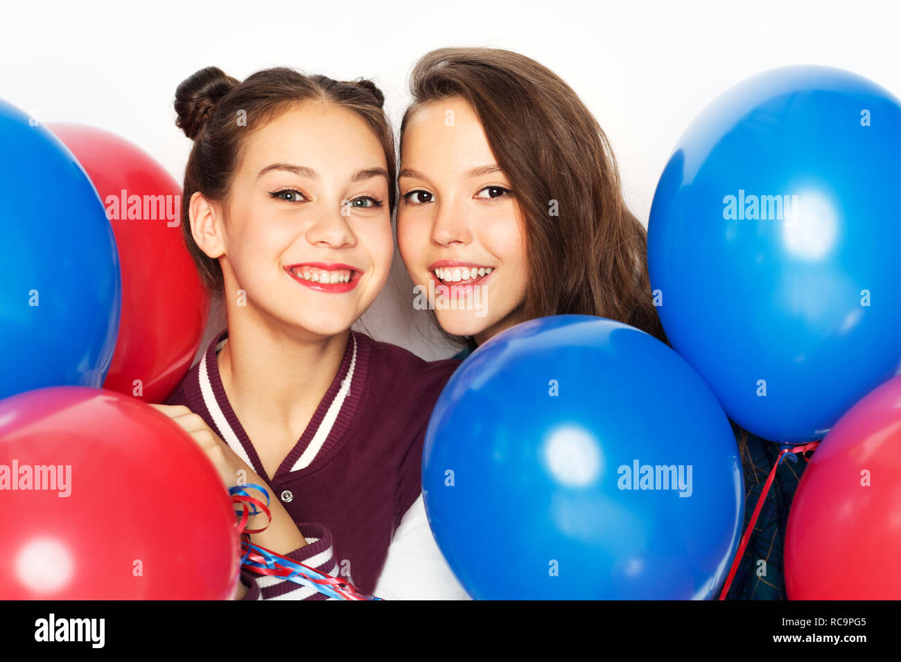 happy teenage girls with helium balloons Stock Photo - Alamy