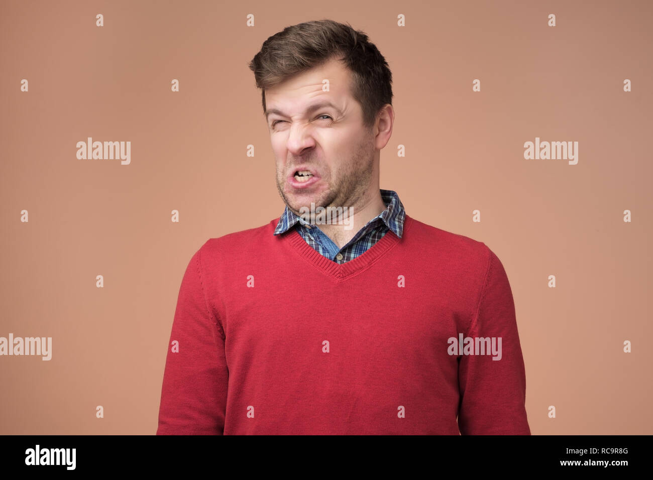 Disguting smell concept. Shocked young man looking at something ...