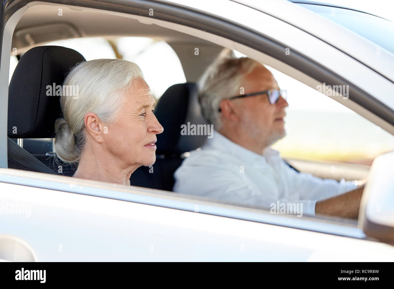 happy senior couple driving in car Stock Photo - Alamy