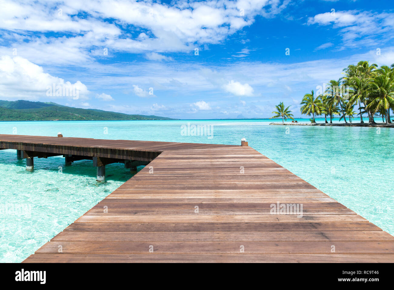 Wooden pier on tropical beach hi-res stock photography and images - Alamy