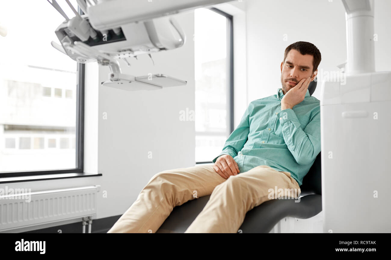 patient suffering from toothache at dental clinic Stock Photo - Alamy