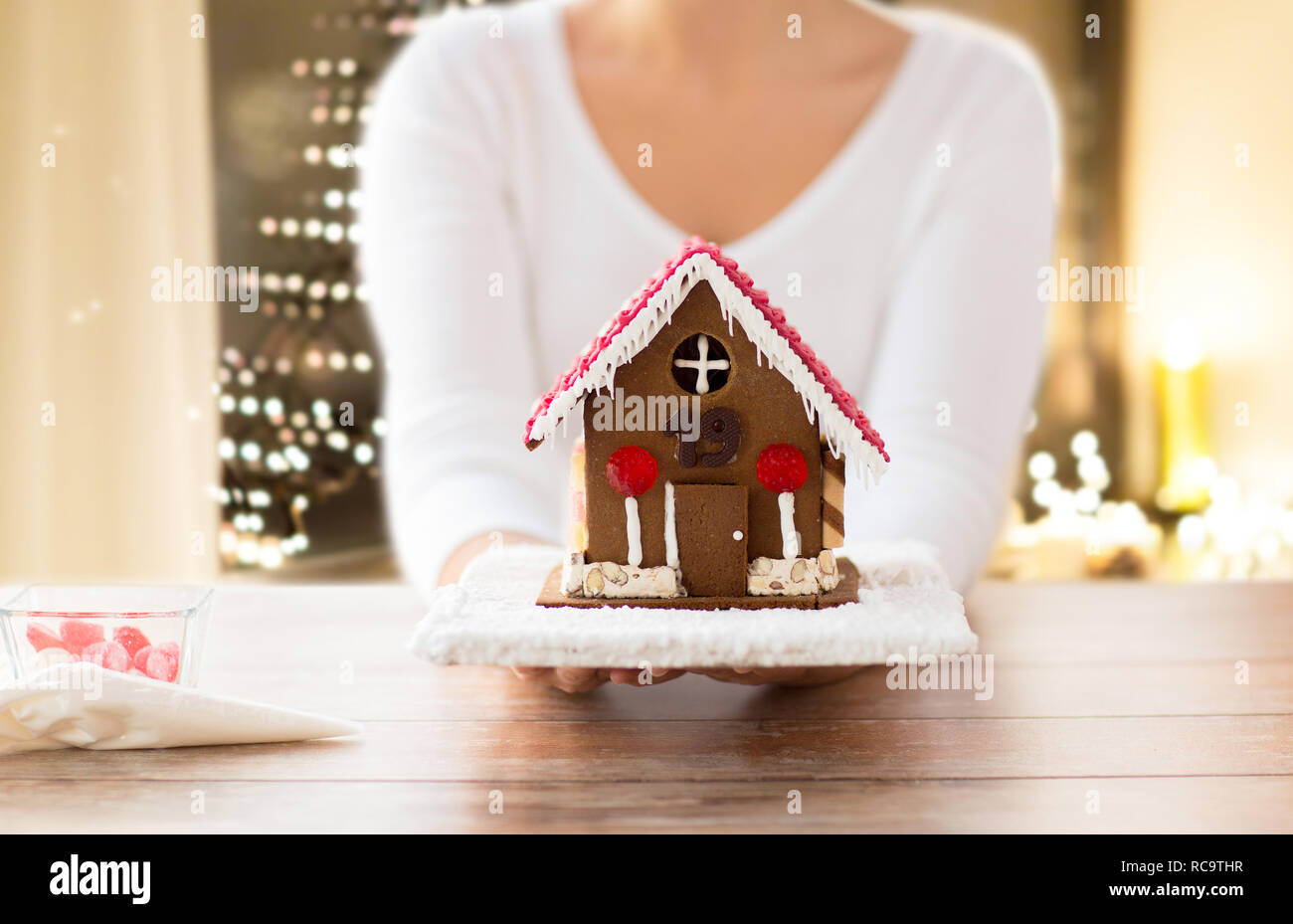Woman glazing traditional gingerbread hi-res stock photography and ...