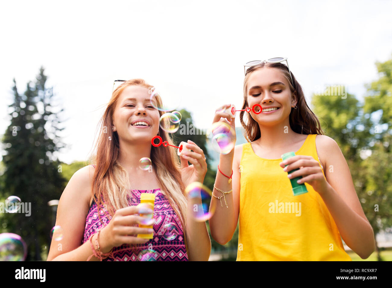 Girls blowing bubbles together hi-res stock photography and images - Alamy