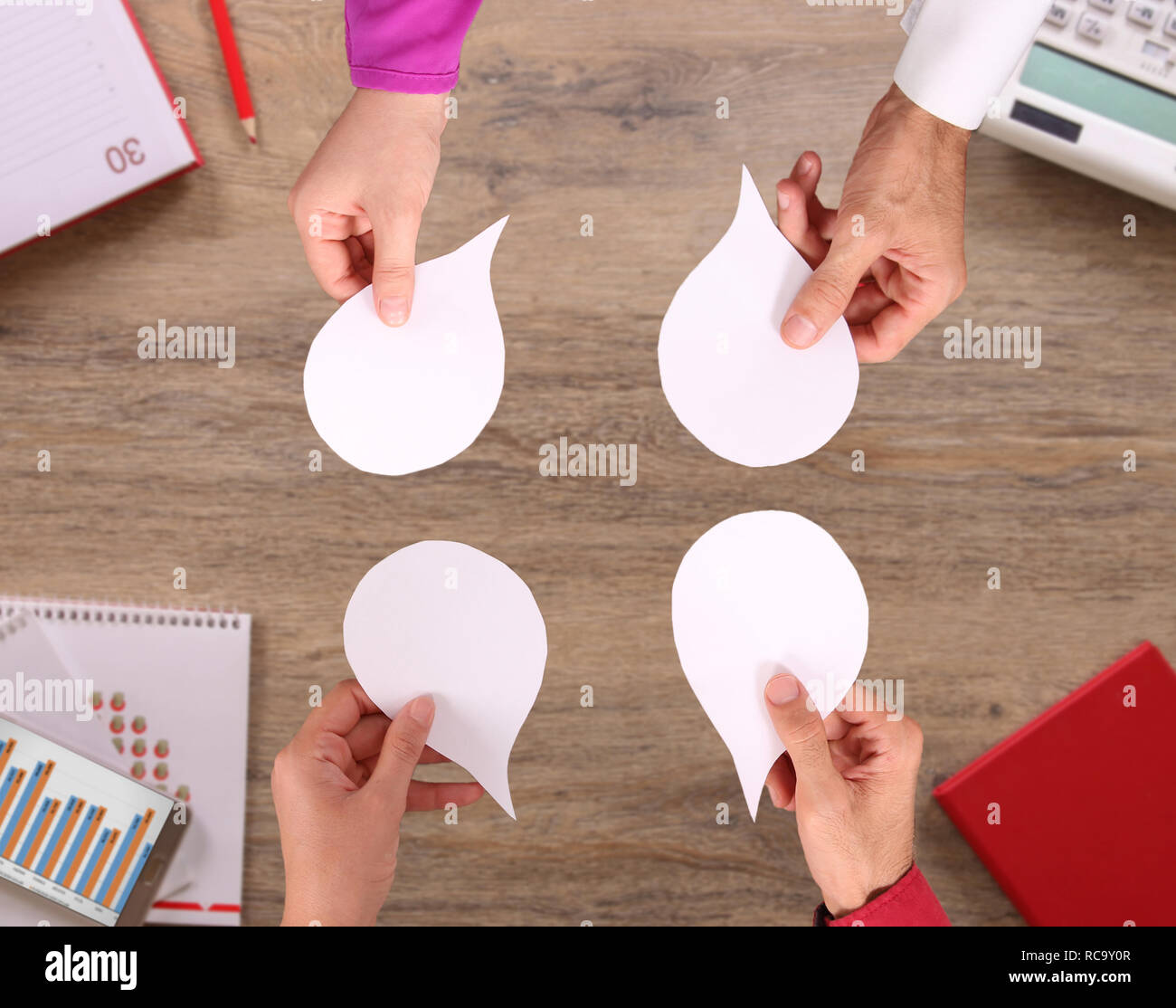 employees hold speech bubbles in their hands at meeting Stock Photo - Alamy