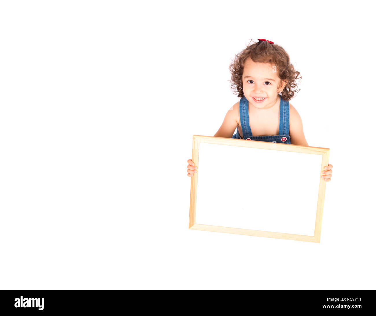 Little cute girl holding empty frame in hand Stock Photo - Alamy