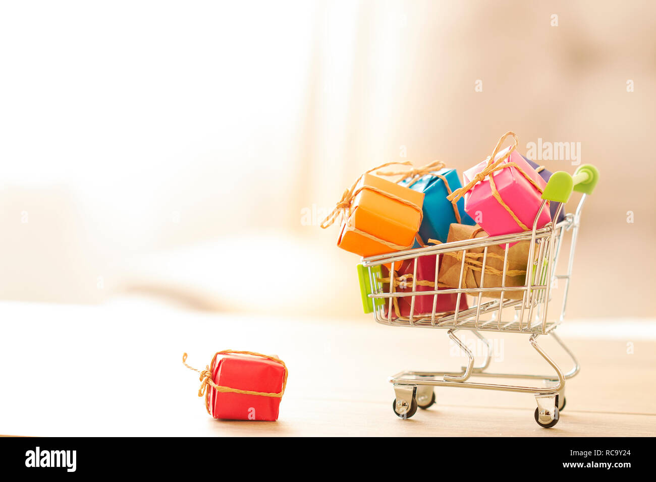 shopping cart filled with colorful gift box Stock Photo - Alamy