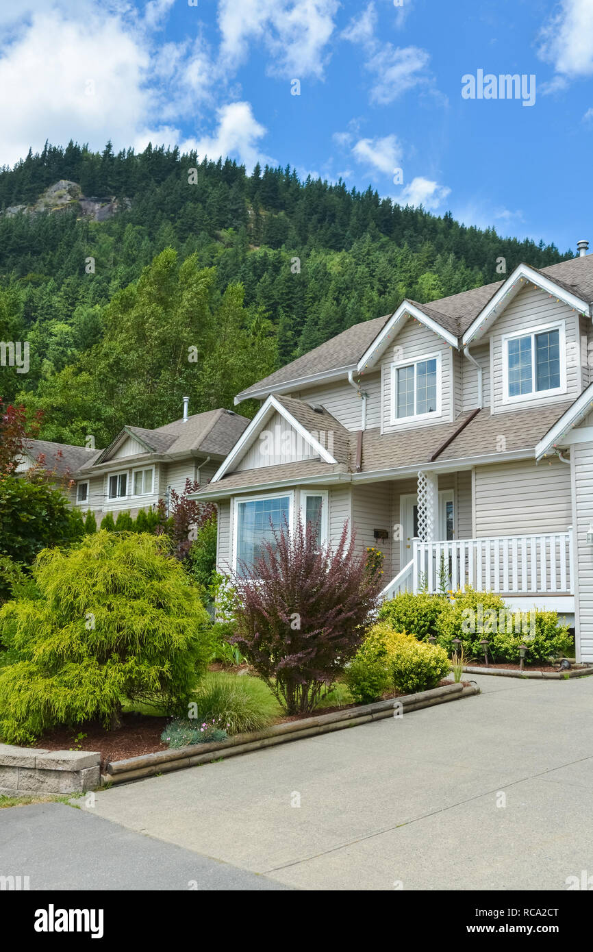 North American house in rural area with nicely landscaped front yard ...