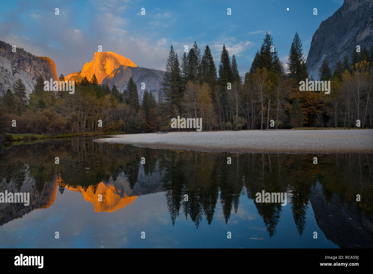 Half Dome rises above the Merced River and the forest in Yosemite ...