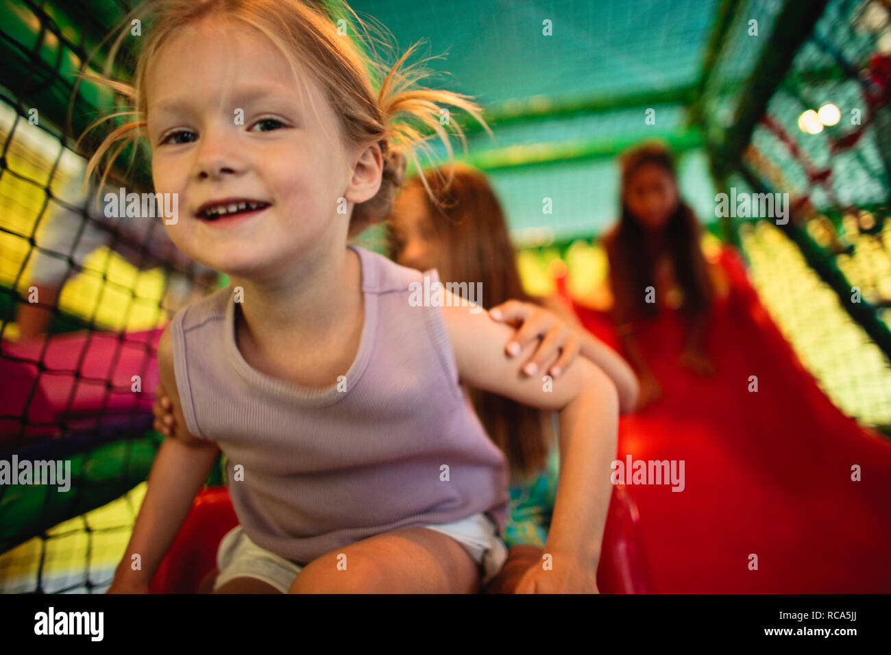 Young girls playing in playground Stock Photo - Alamy