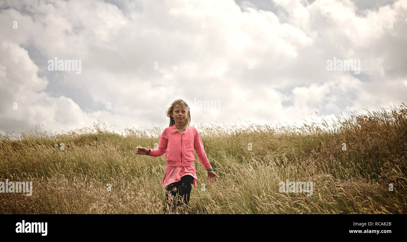 Three children walking through hi-res stock photography and images - Alamy