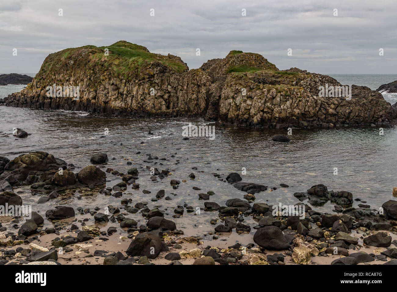 Beach and rocks in Ballintoy Harbour, Moyle, Northern Ireland, UK Stock ...
