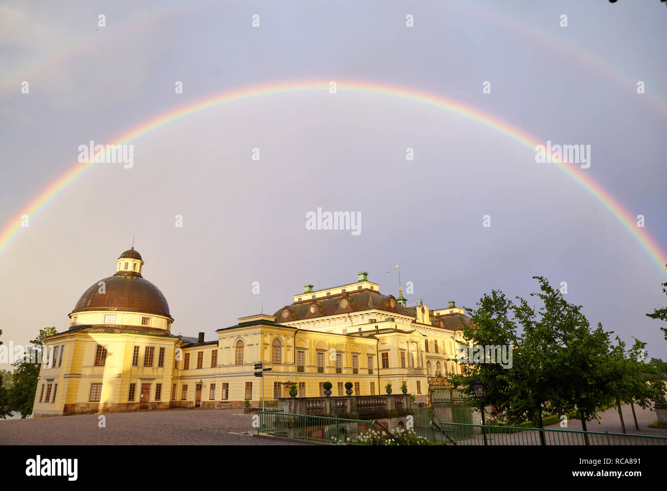 Rainbow above building Stock Photo - Alamy