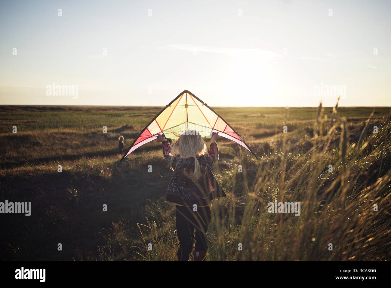 Girl with kite Stock Photo - Alamy