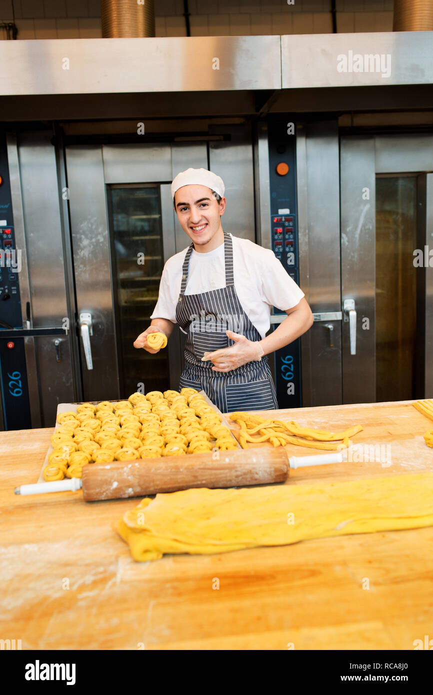 Baker working in bakery Stock Photo - Alamy