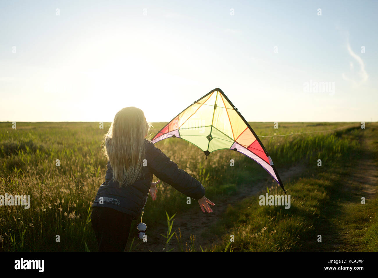 Girl with kite Stock Photo - Alamy