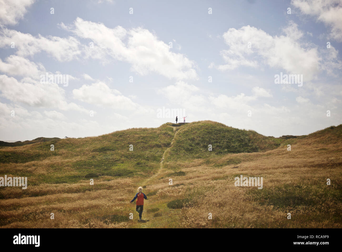 Children Running Through Meadow High Resolution Stock Photography and ...