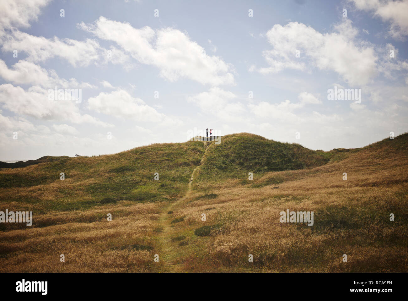 People on hill Stock Photo - Alamy