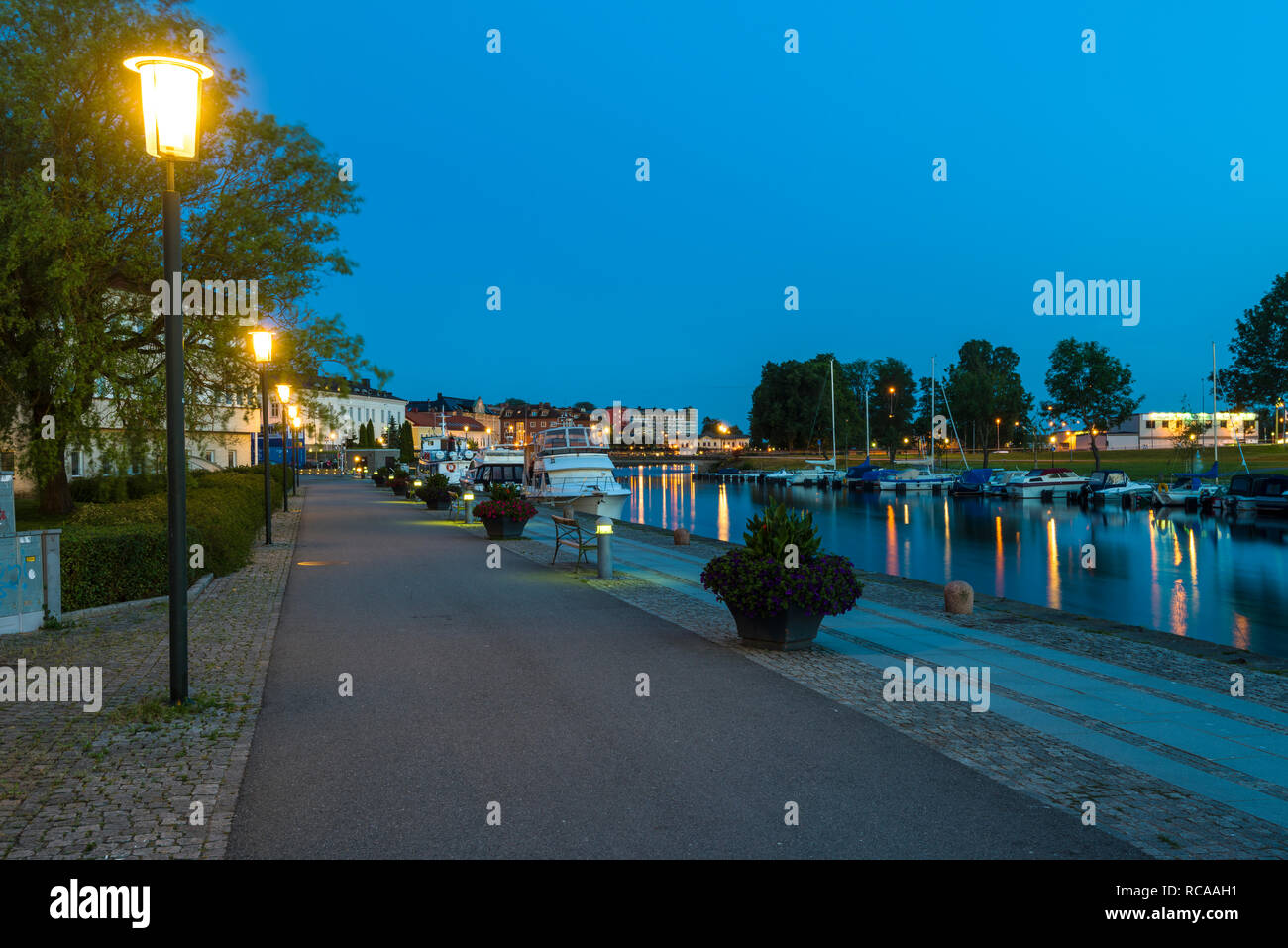 Empty promenade at water Stock Photo - Alamy