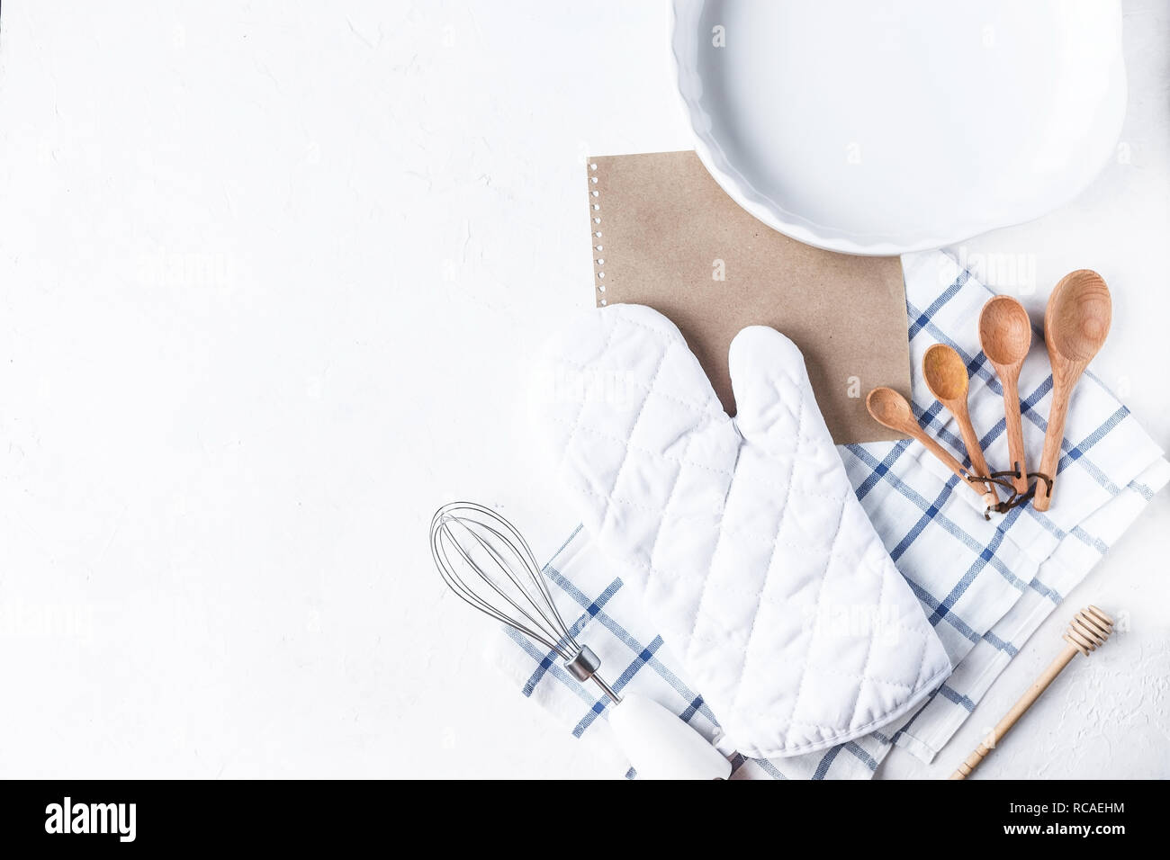 dishes and kitchen accessories for baking on the Kitchen table on a ...