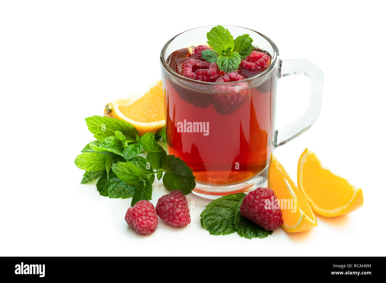 Red fruit tea with raspberry and orange isolated on white background ...