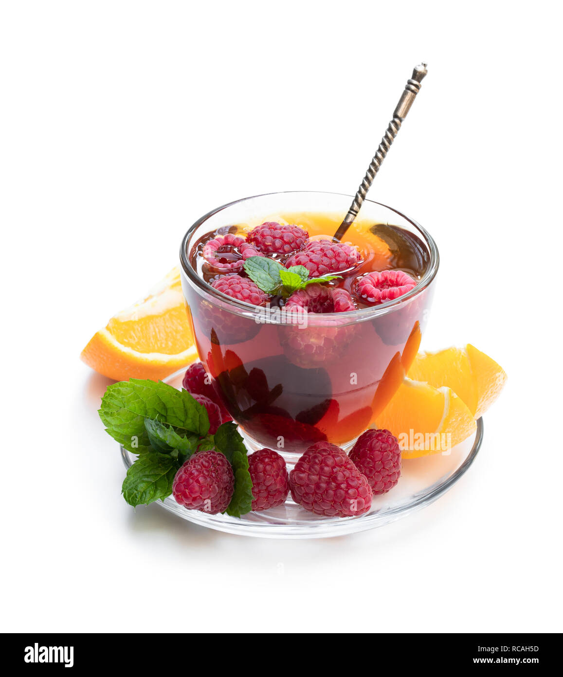 Red fruit tea with raspberry and orange isolated on white background ...