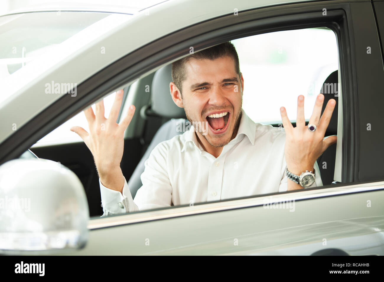 Happy car owner in his new car Stock Photo - Alamy