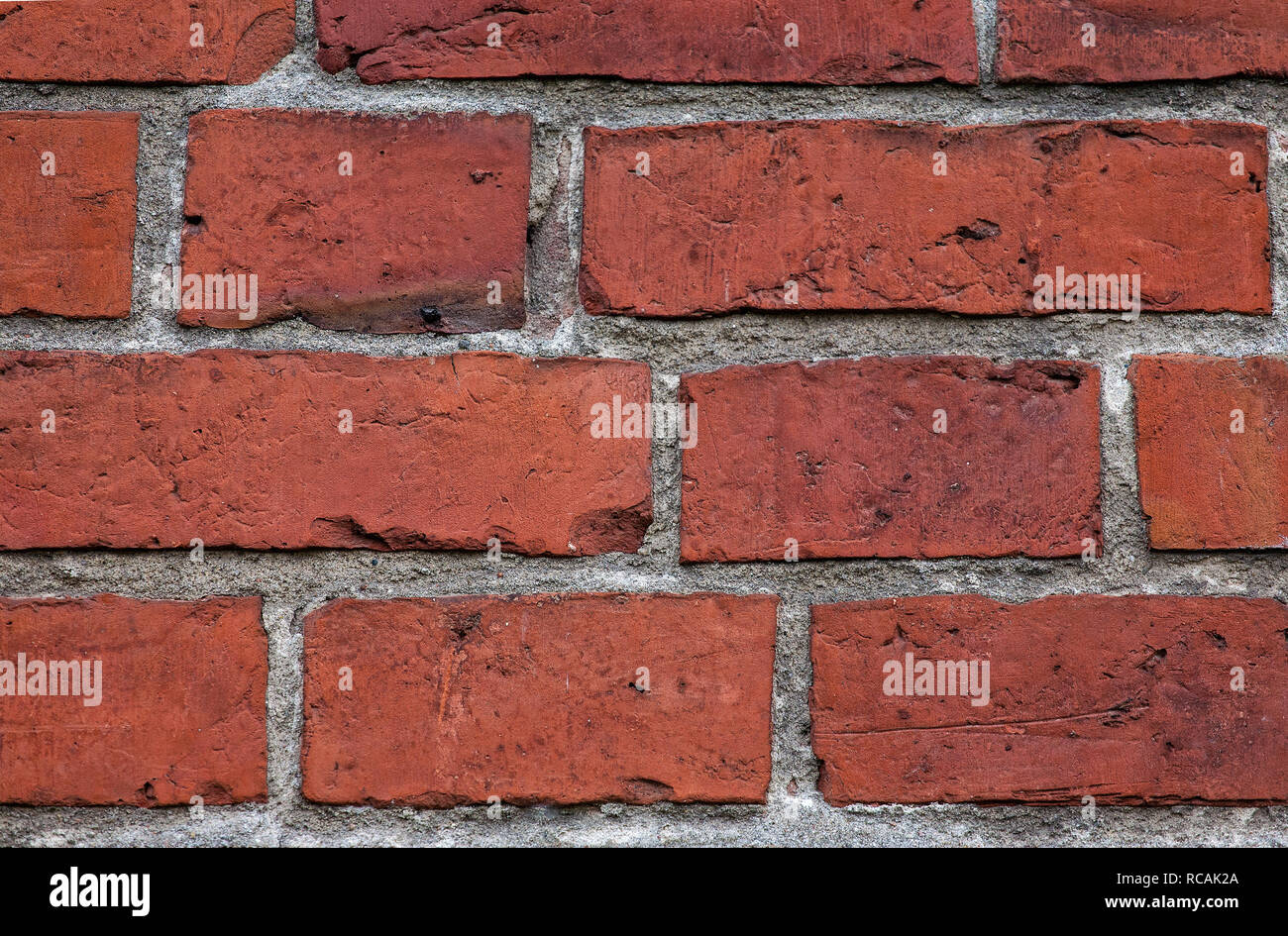 Rugged red brick wall Stock Photo - Alamy