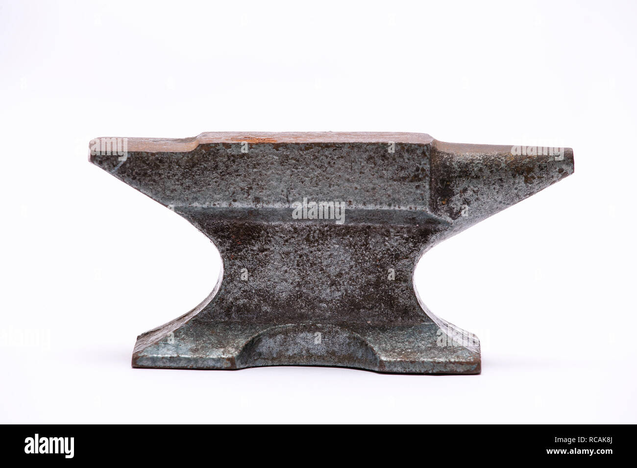 Old rusty rugged anvil Stock Photo - Alamy