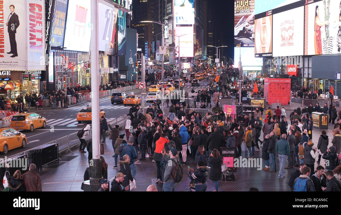 Times Square in Manhattan by night is a busy place - NEW YORK / USA ...