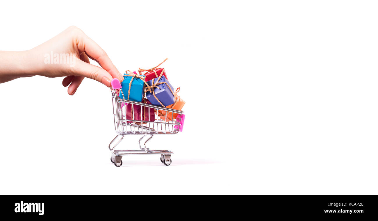 hand push shopping basket filled with gift box Stock Photo - Alamy