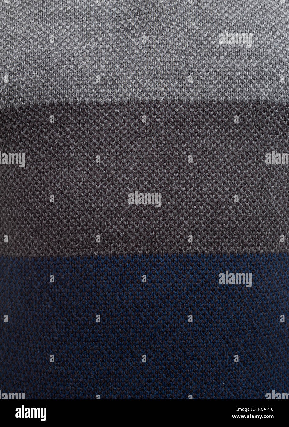 Close-up of three coloured grey and blue sweater as knitted winter ...