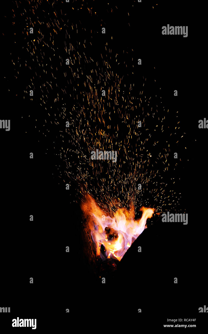 smithy fire flame tips with sparks closeup on dark background Stock ...