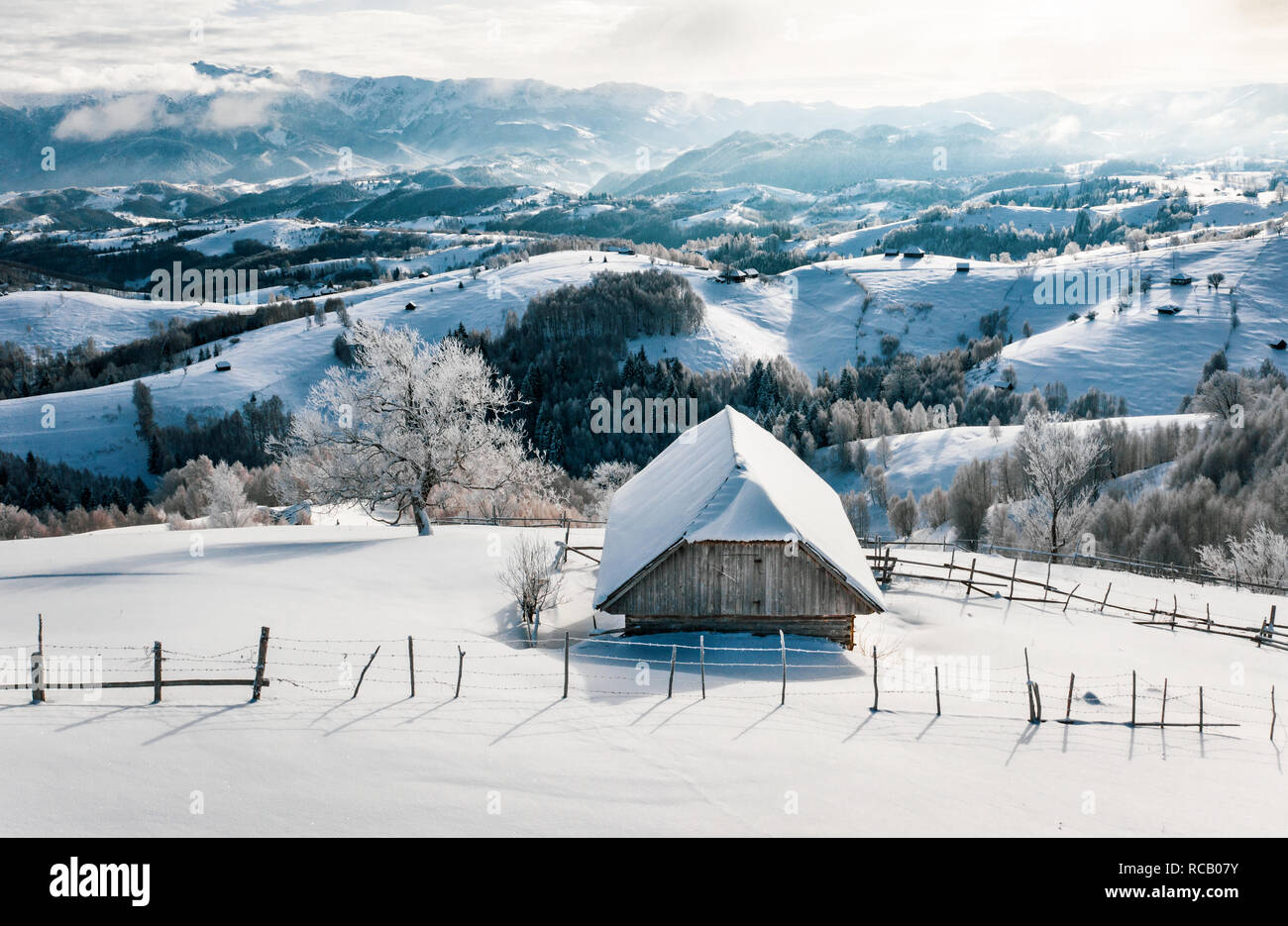 Traditional peasant house covered in snow in Transylvania Romania ...