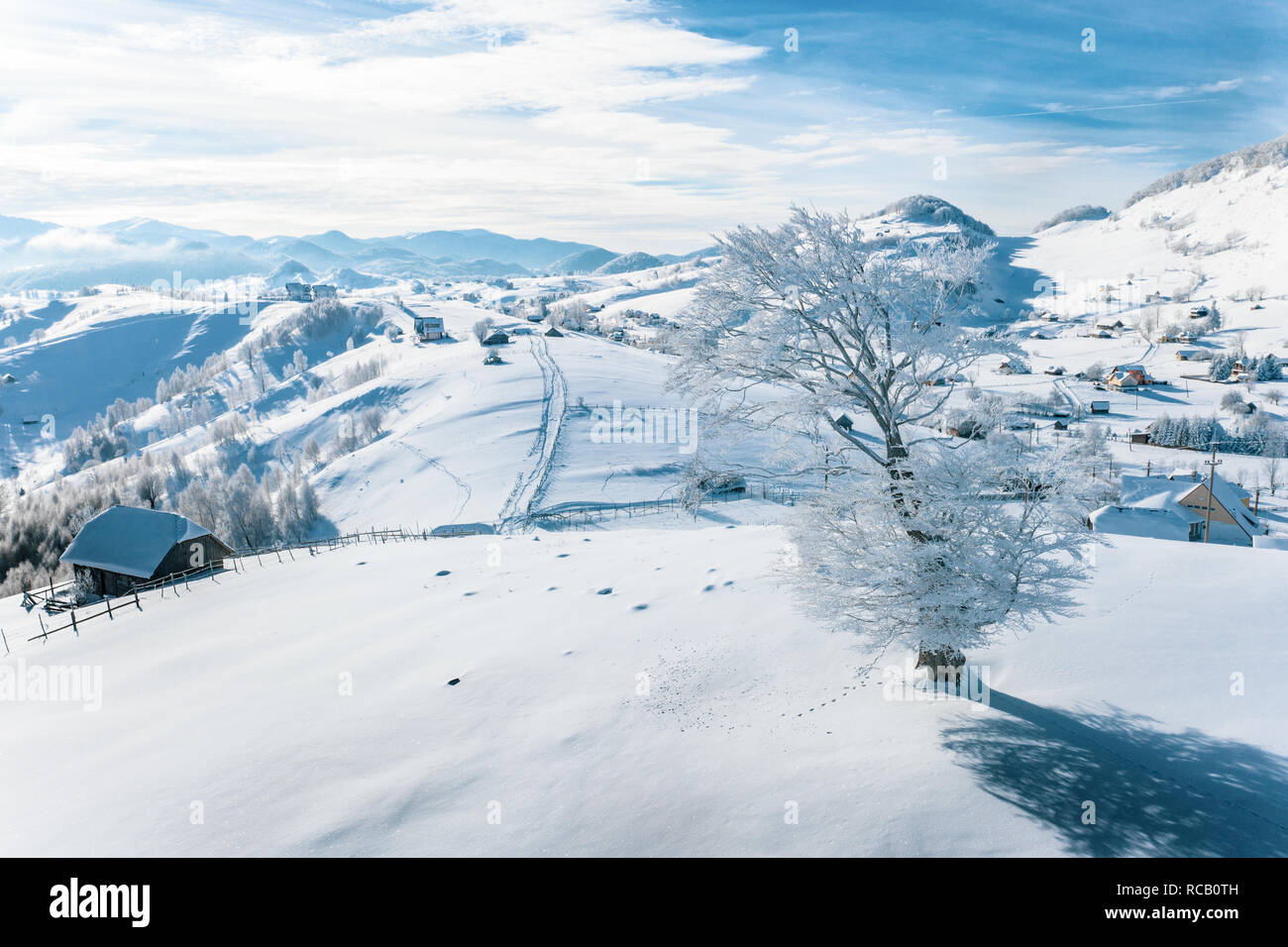 Snowfall in Romania traditional village Pestera on the Rucar Bran Pass ...