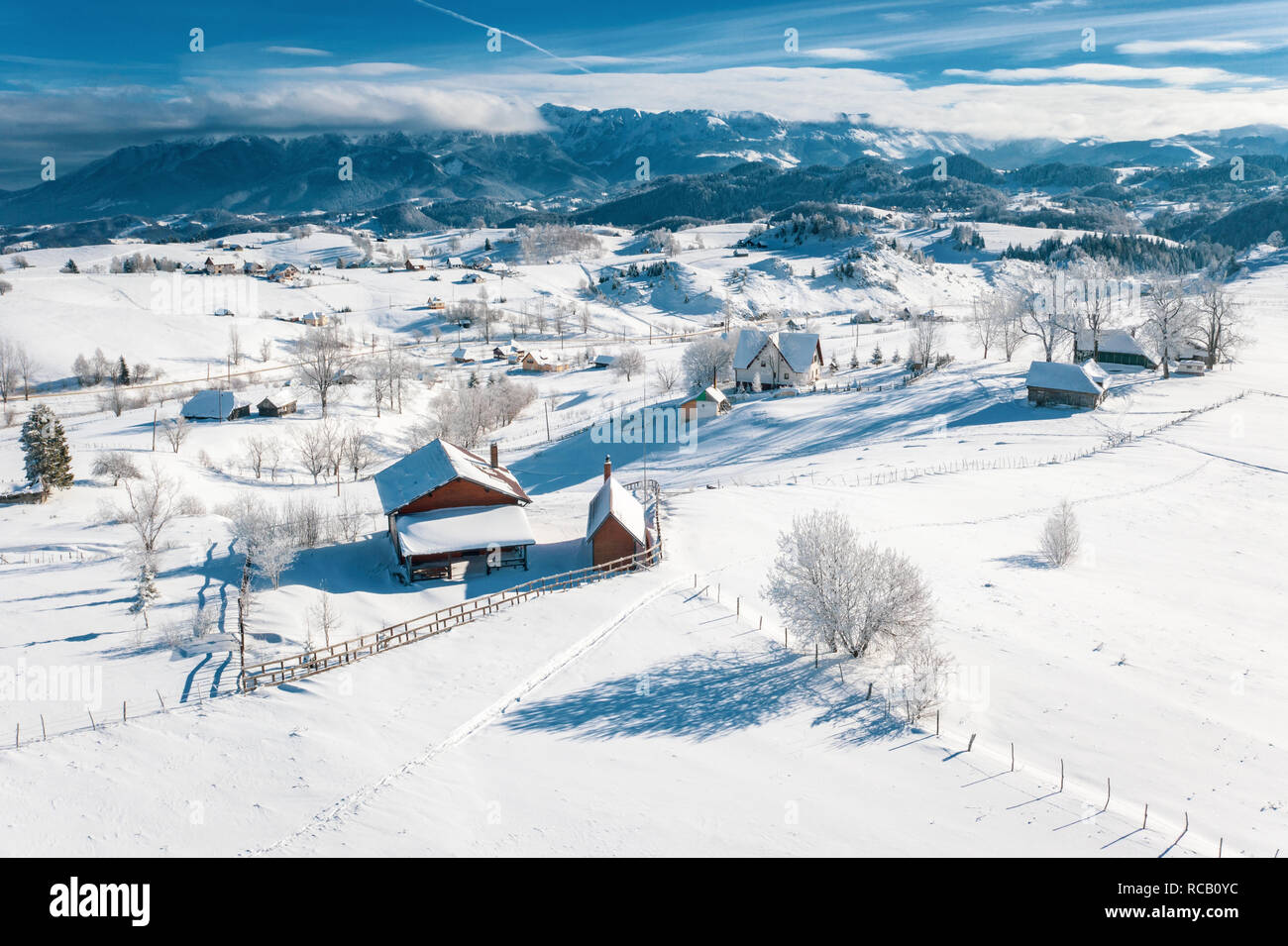 Aerial view of Sirnea Village covered with snow near Christmas in ...