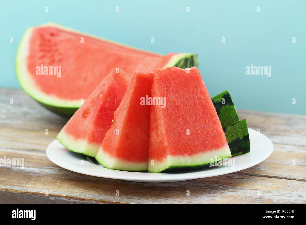 Slices of fresh watermelon on white plate Stock Photo - Alamy