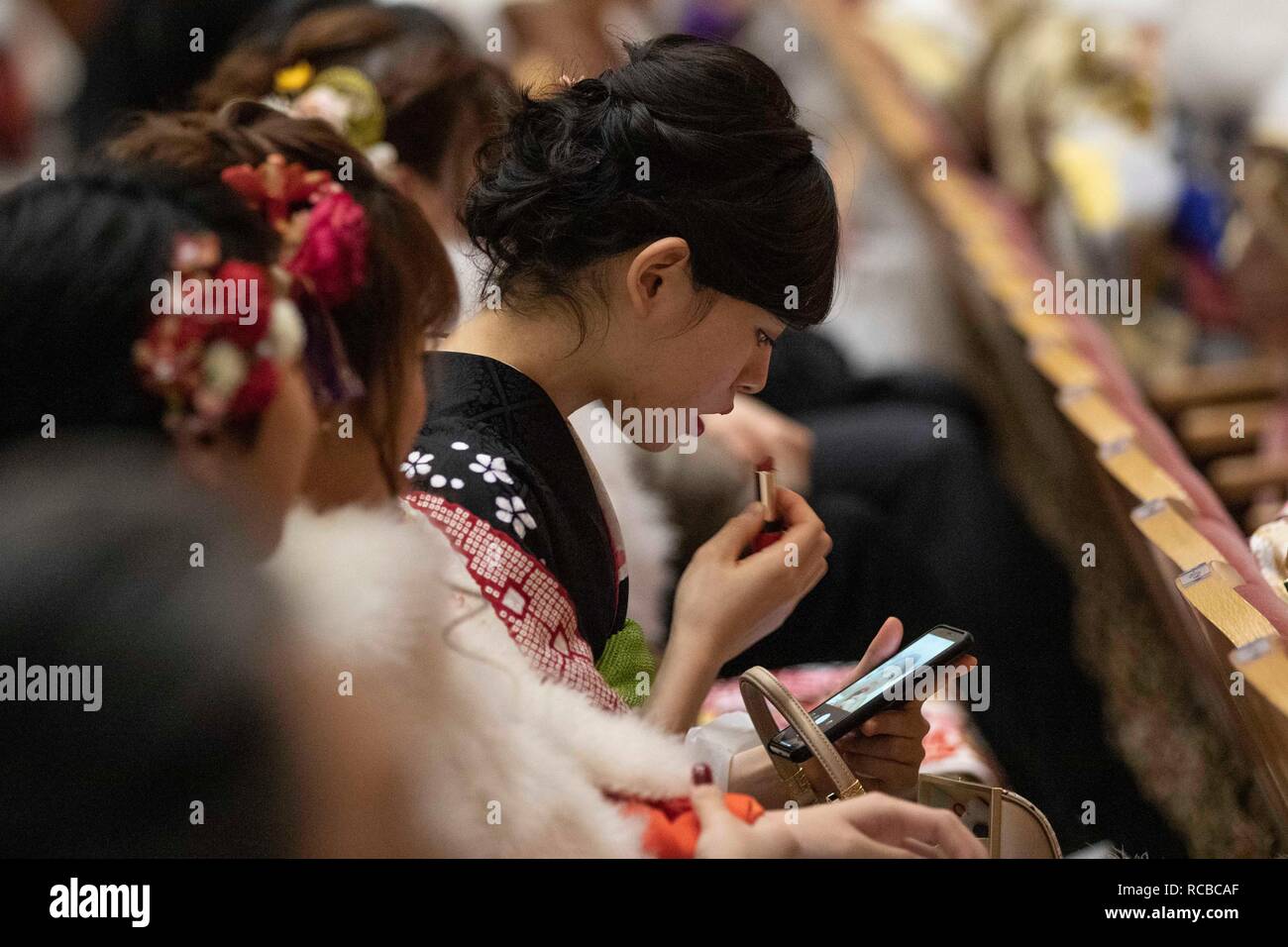 Japanese girls dressed in colorful kimonos attend the Coming of Age Day ...