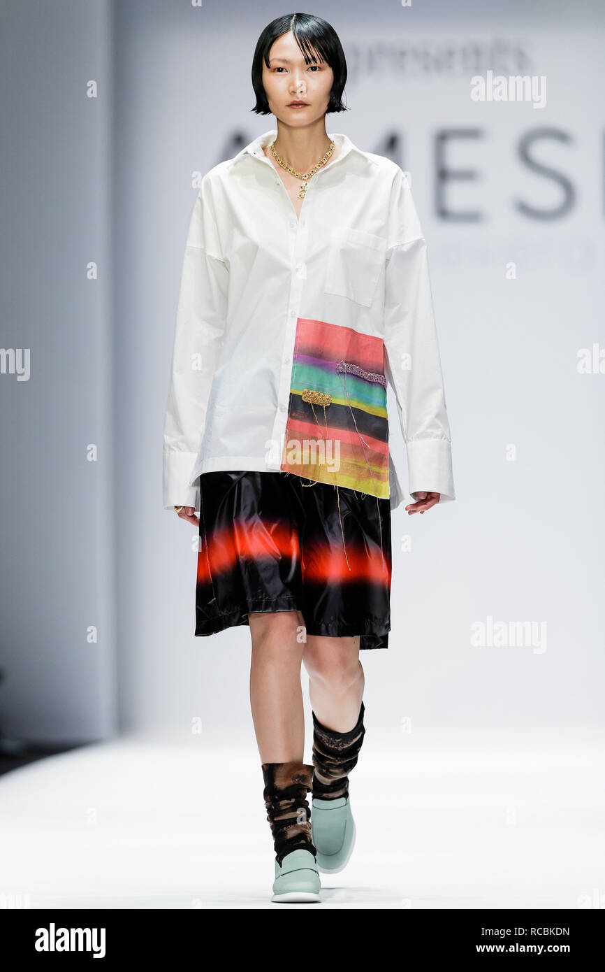 Berlin, Germany. 15th Jan, 2019. A model displays a creation of Sri ...