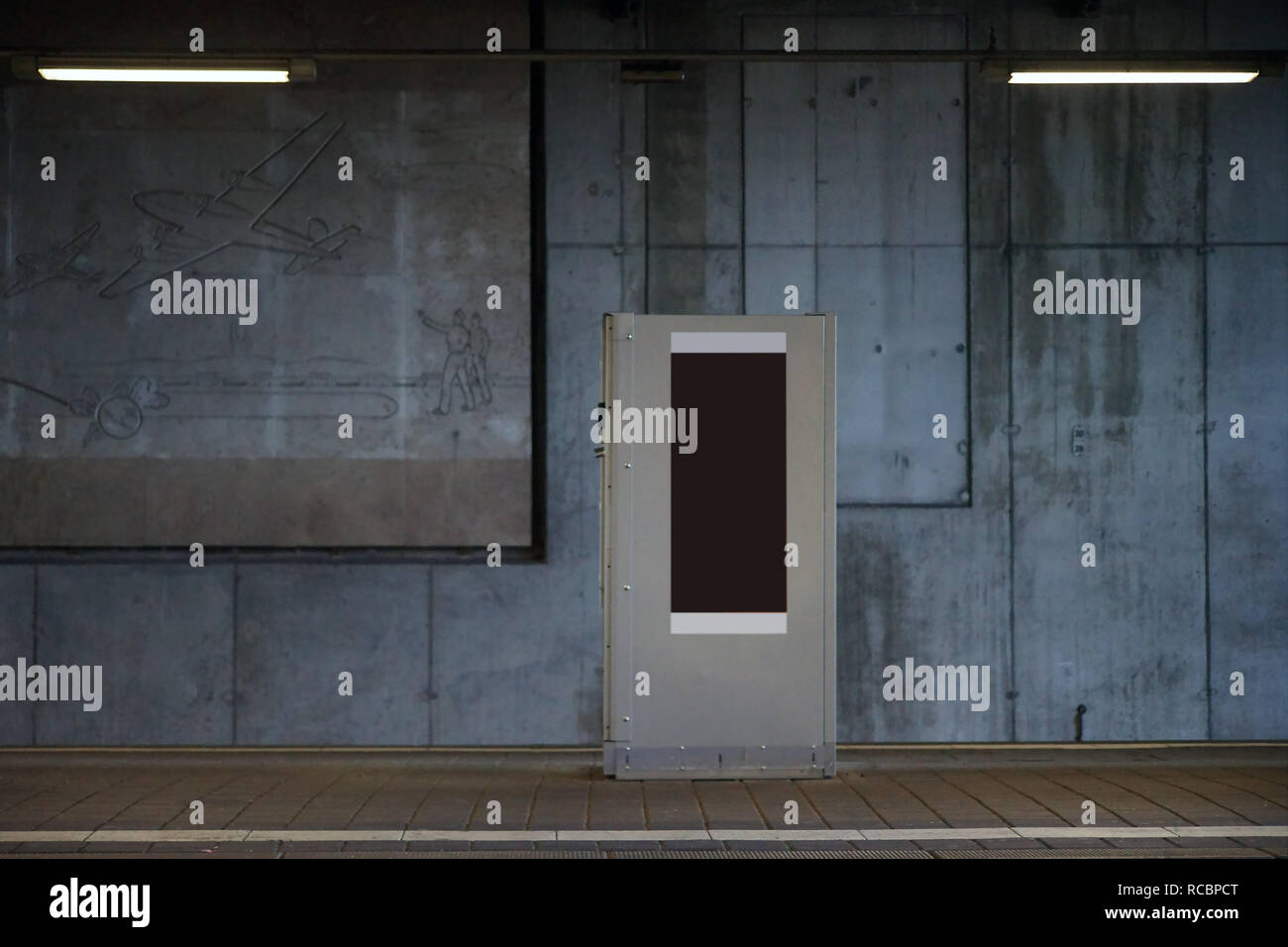 A striking platform wall with doodles and an electric box Stock Photo ...