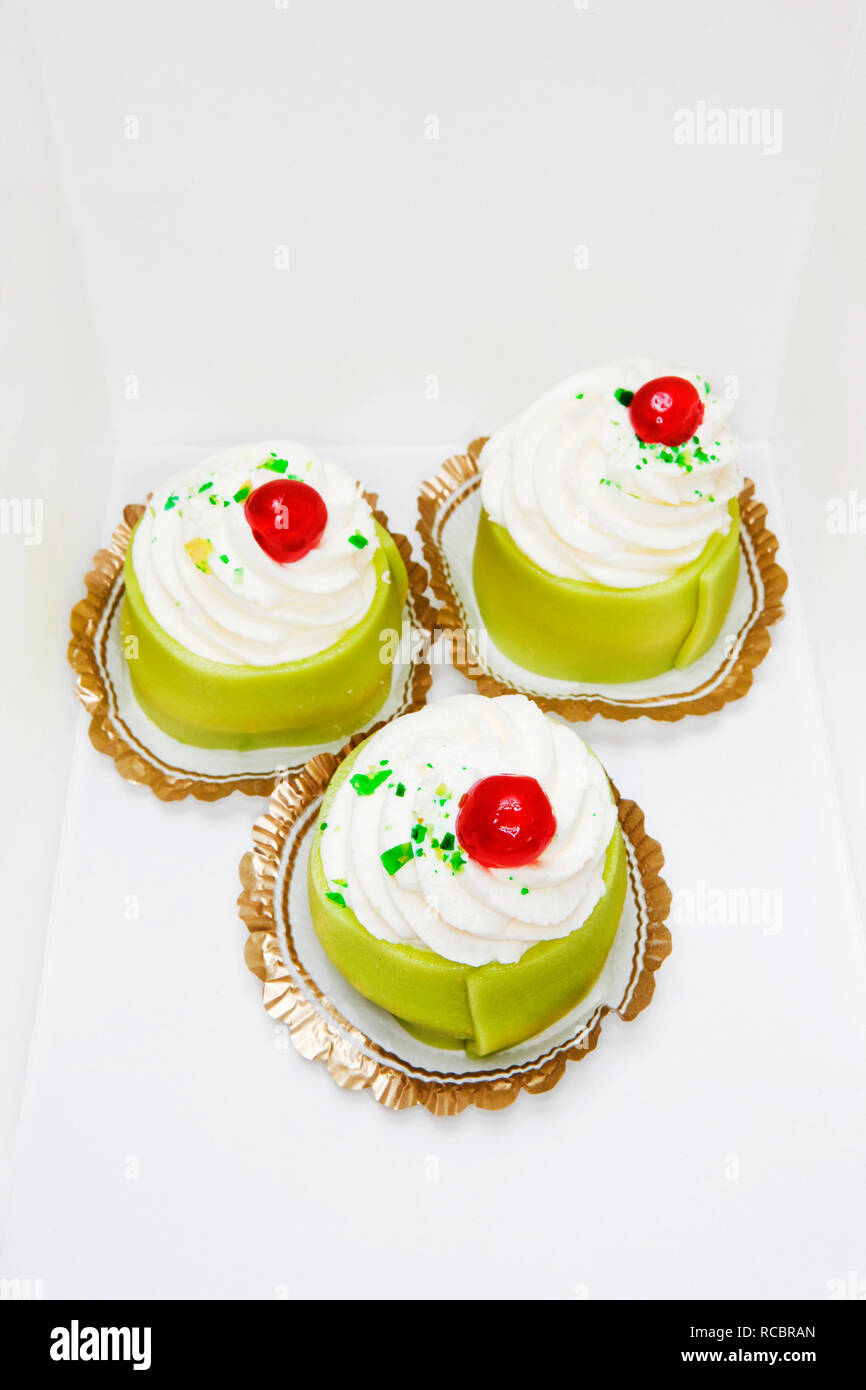 Sweet cakes on white background Stock Photo - Alamy
