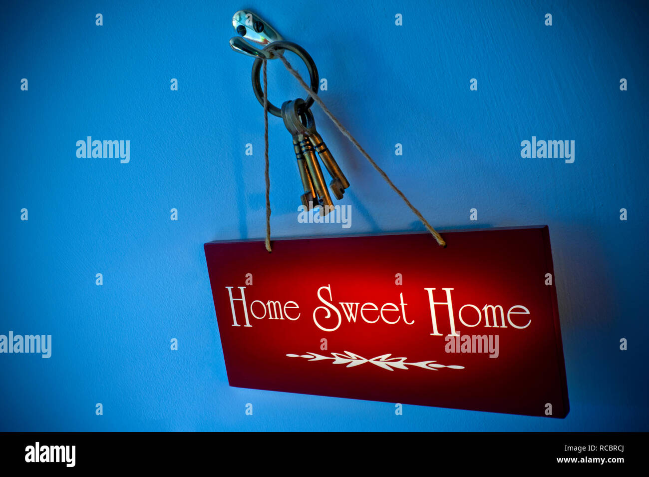 Atmospheric Concept Home Owner "Home Sweet Home" sign hanging with ...