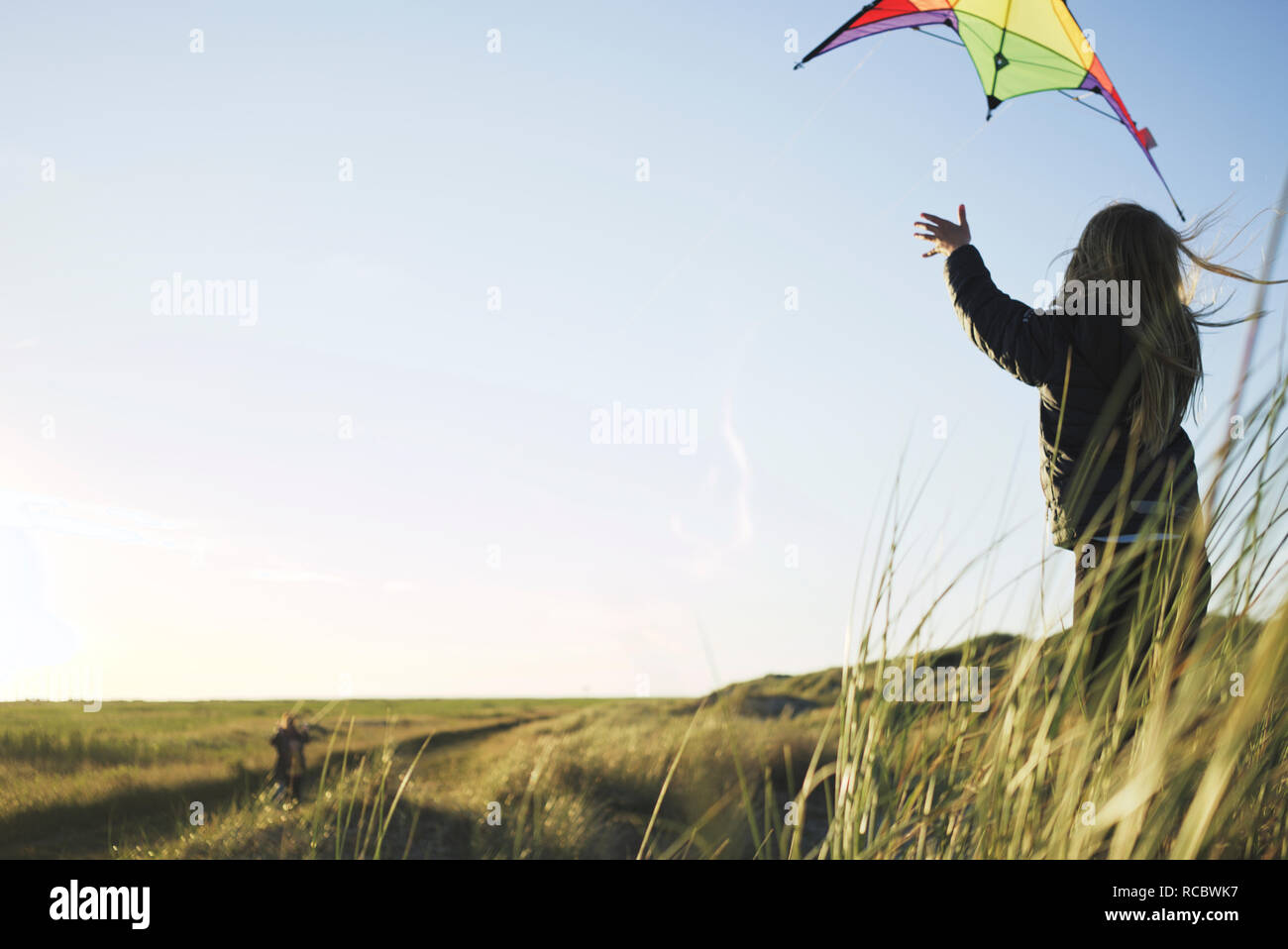 Girl with kite Stock Photo - Alamy