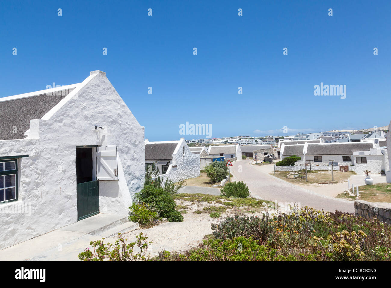 Traditional whitewashed cottage in the quaint fishing village of ...
