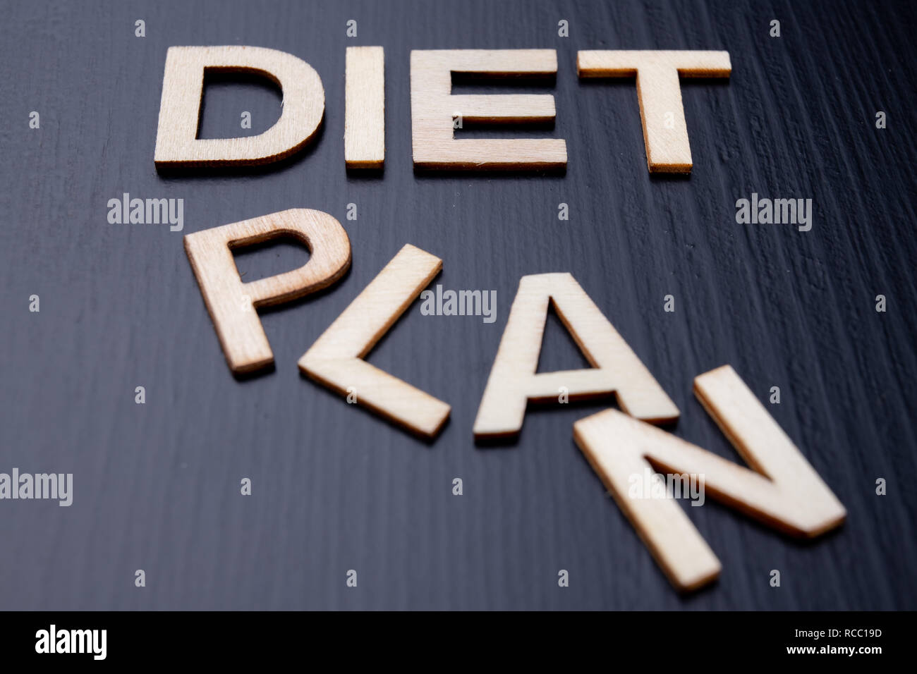 The inscription is arranged from letters cut out of wood on the table ...