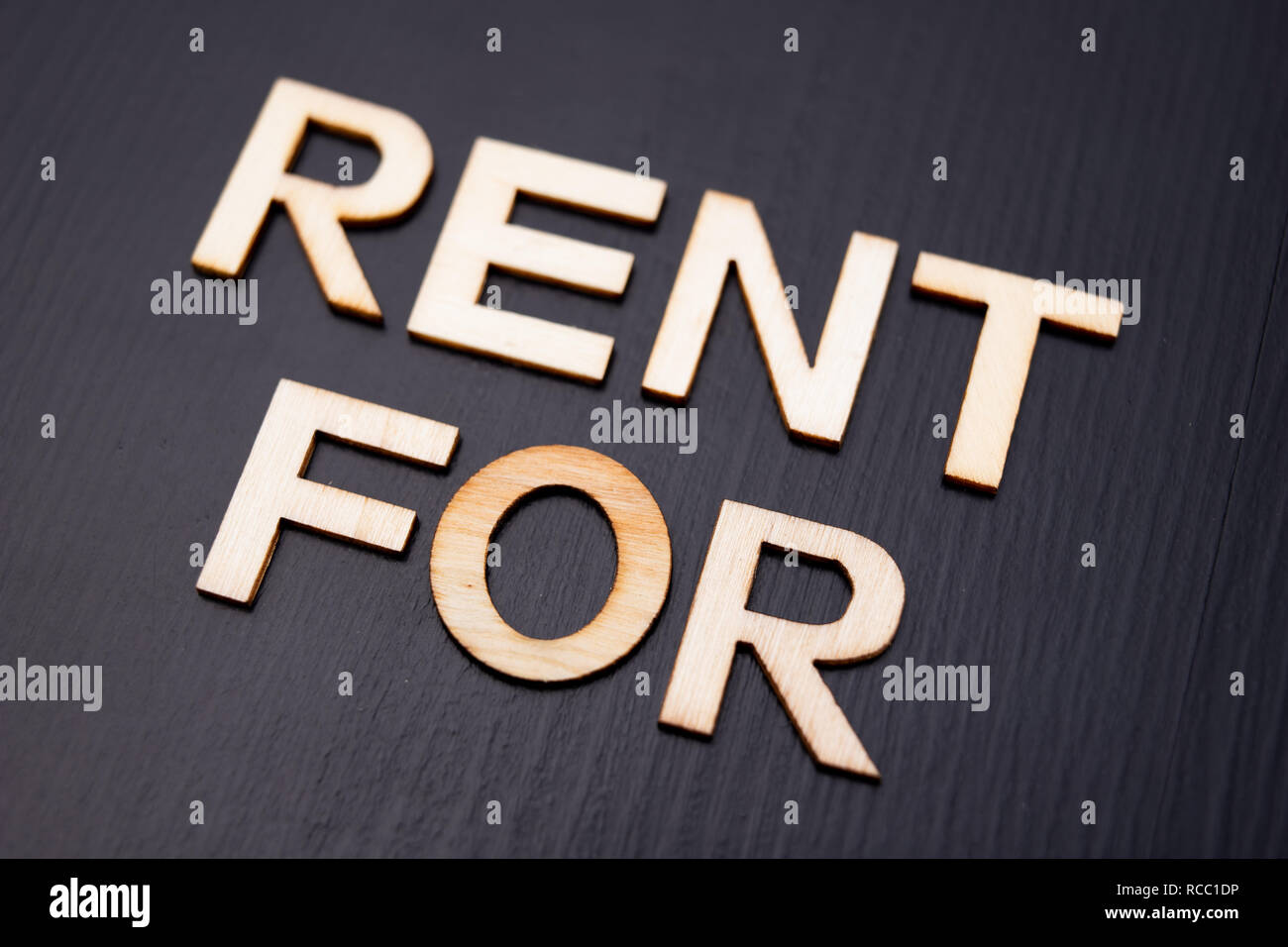 The inscription is arranged from letters cut out of wood on the table ...