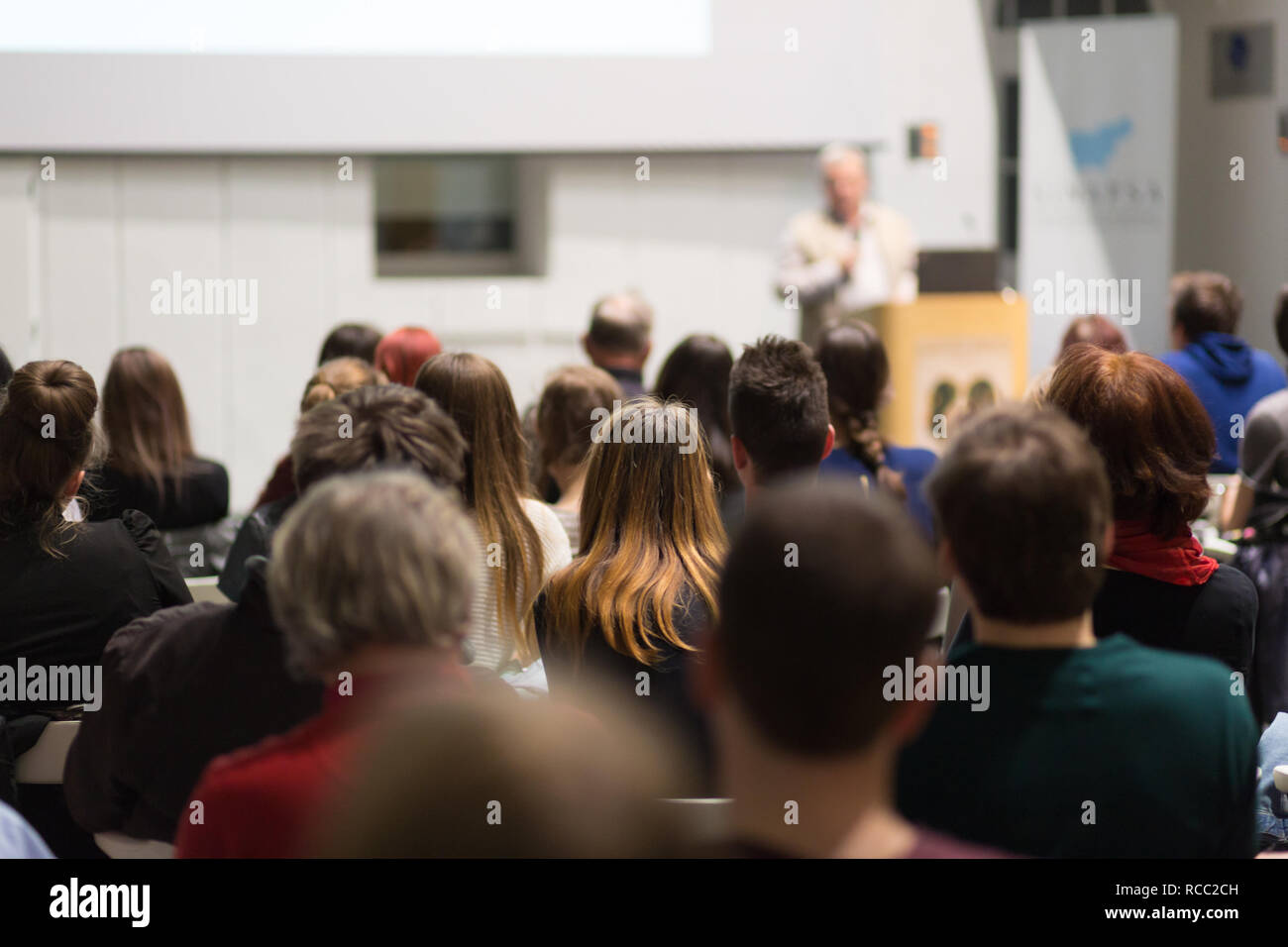 Man giving presentation in lecture hall at university Stock Photo - Alamy