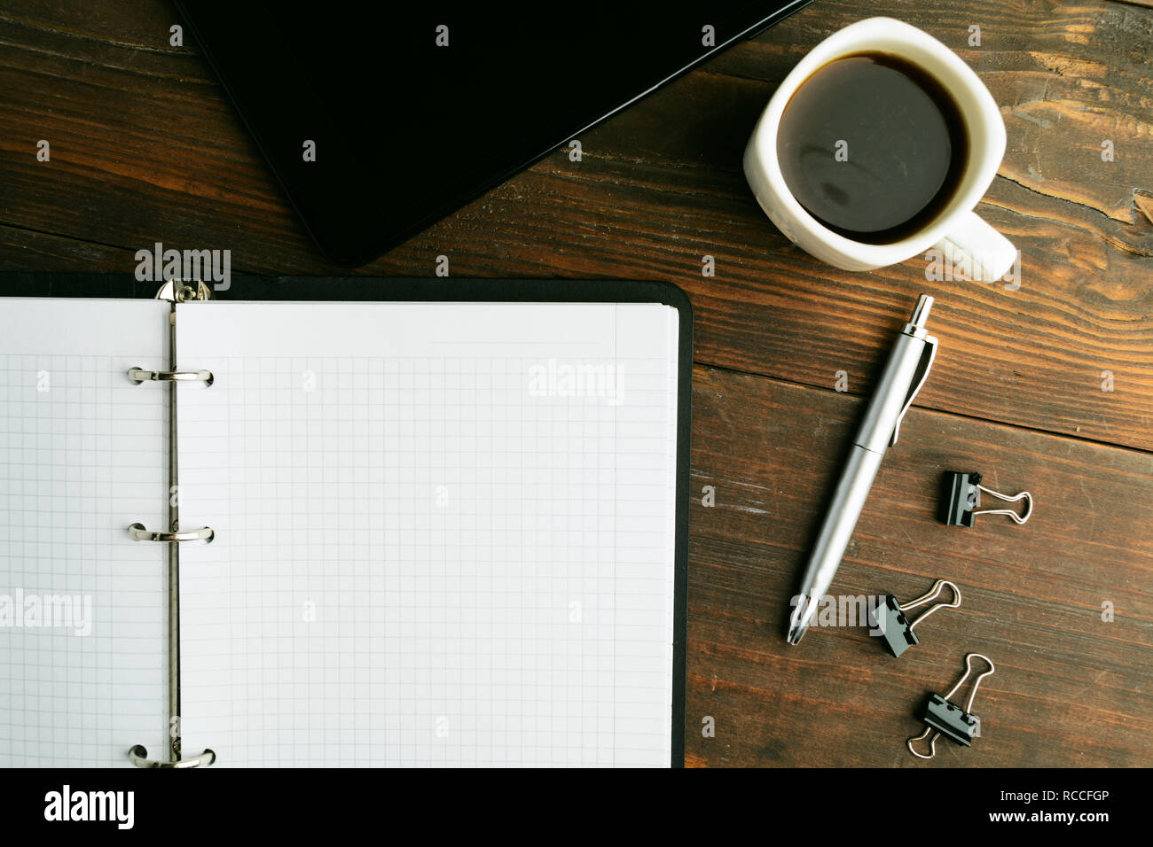 Business concept with notebook, coffee and notepad on brown wooden ...