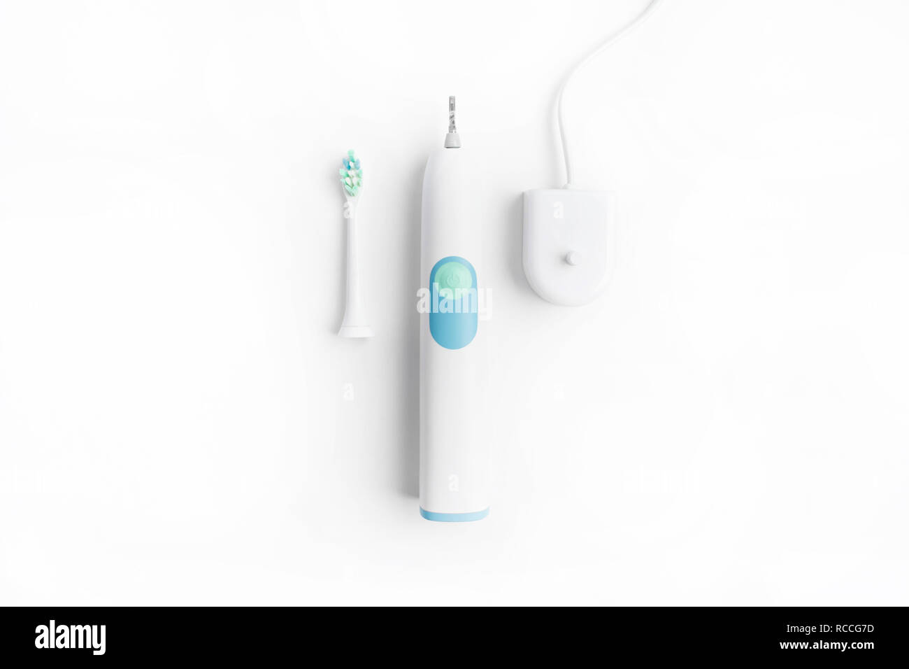 Three part of electric toothbrush in center on white background with ...