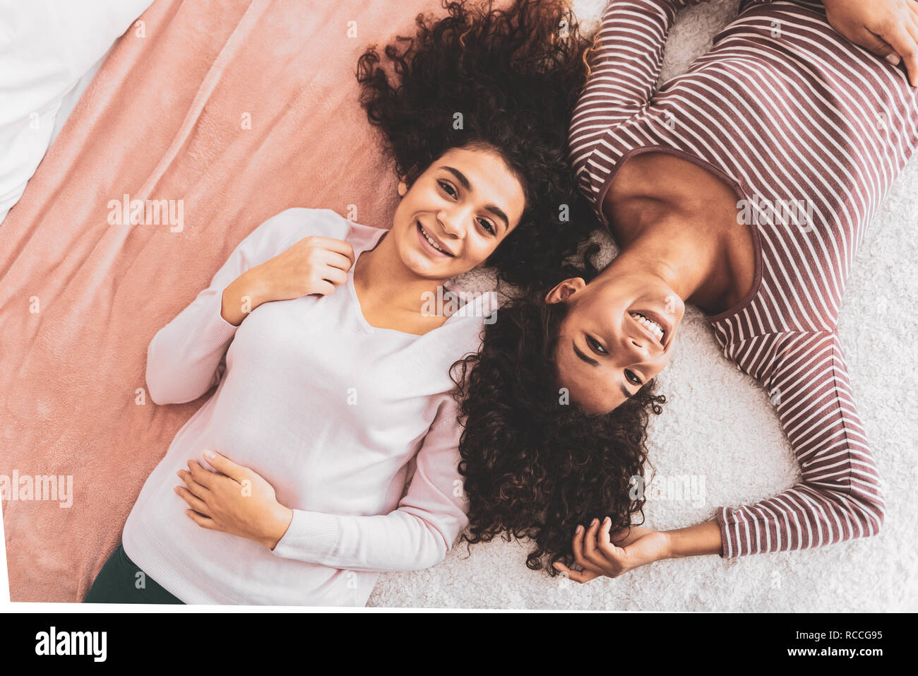 Cute delightful sisters spending memorable time together Stock Photo ...