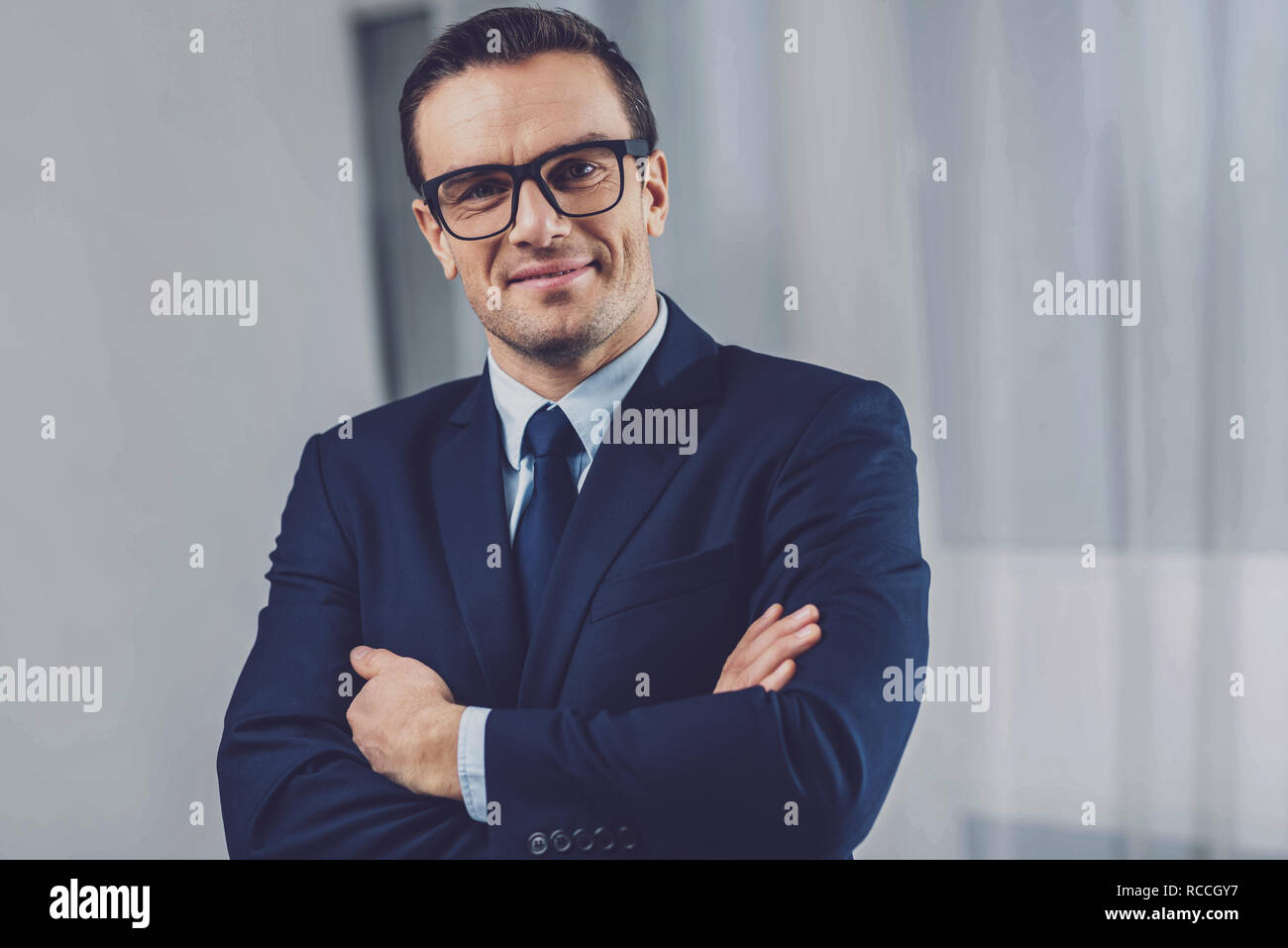 Joyful smart man smiling Stock Photo - Alamy